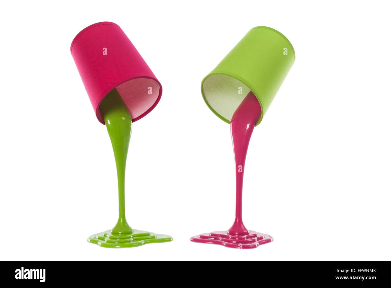 pouring paint from colored container on white background Stock Photo ...
