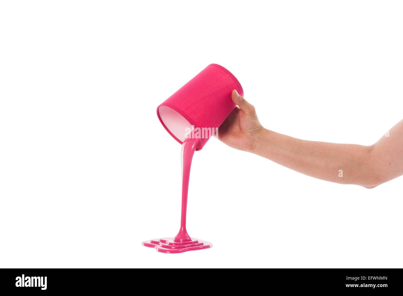 pouring paint from colored container on white background Stock Photo ...