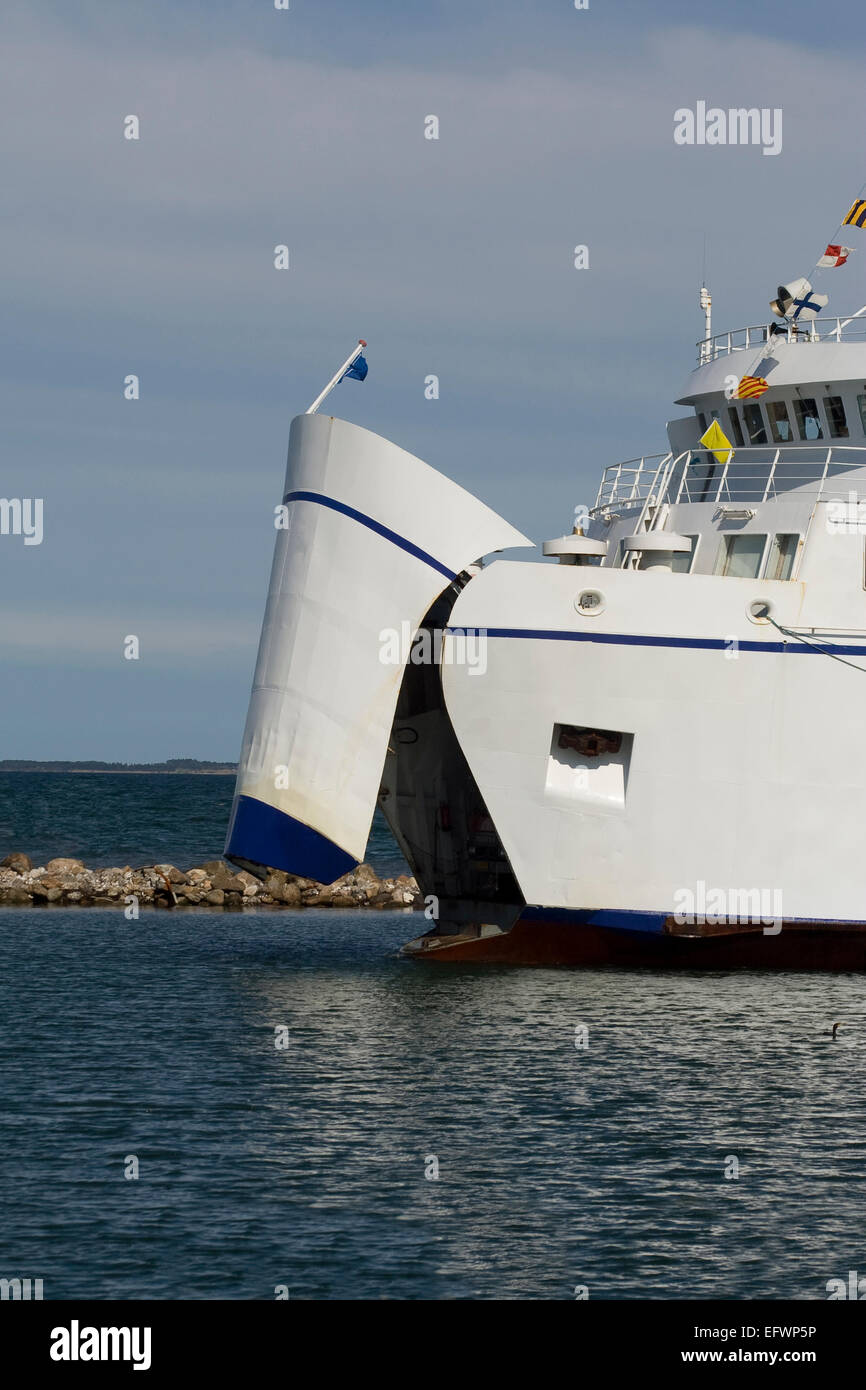 Small ferry entering port. Shot from a small harbour in Denmark Stock ...