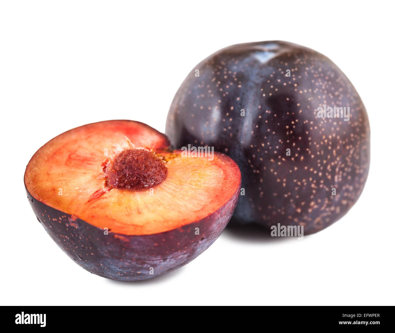 whole plum and half isolated on white background Stock Photo - Alamy