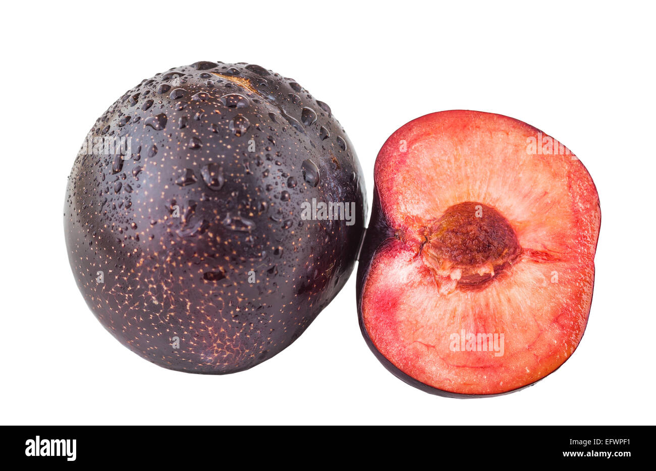 whole plum and half with water drops isolated on white background Stock ...
