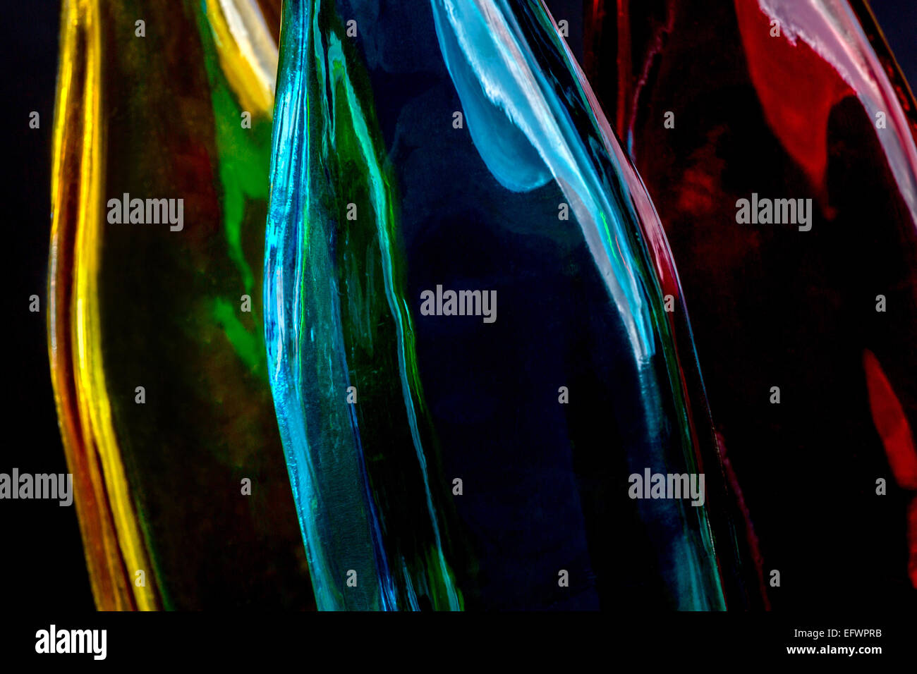 Colored glass bottles, studio photograph Stock Photo - Alamy