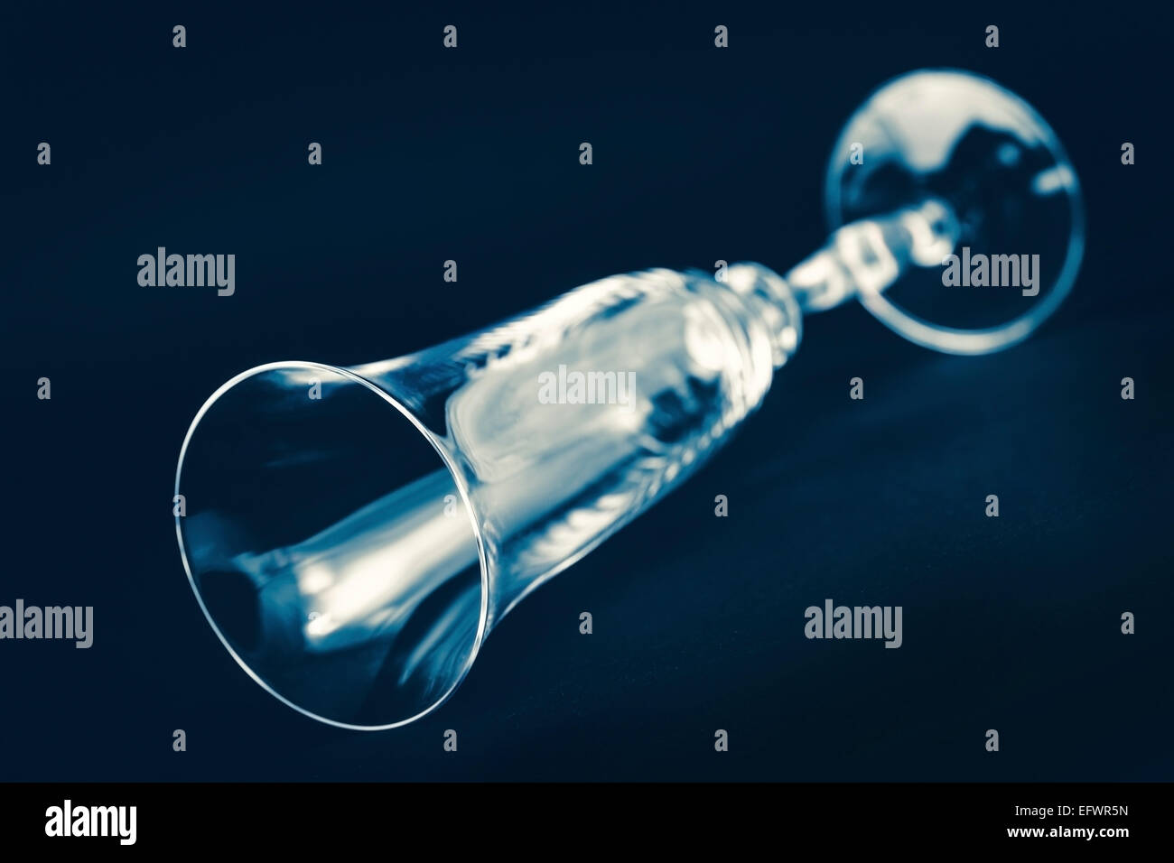 clean empty champagne glass on a dark background Stock Photo - Alamy