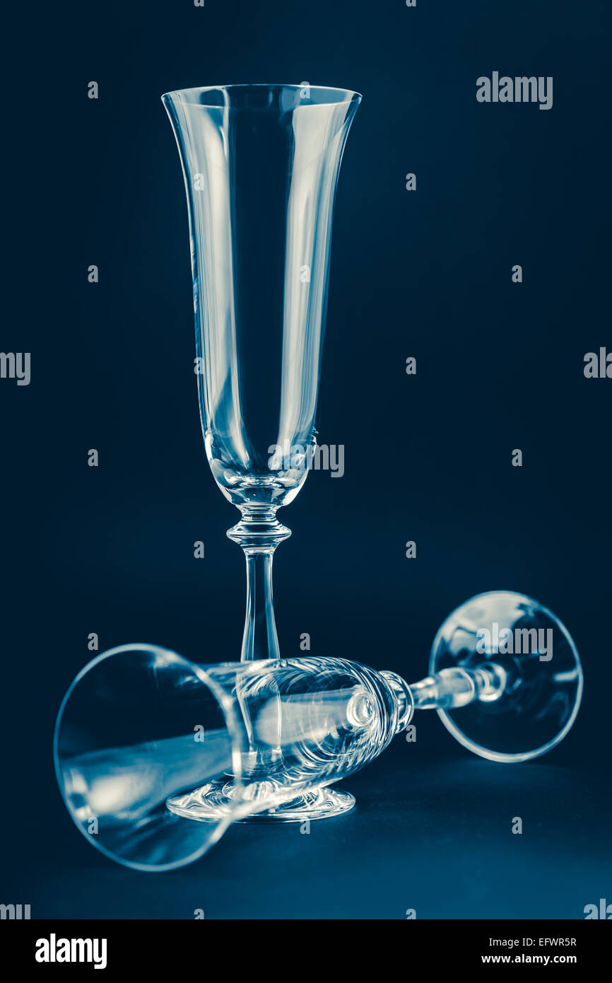 two empty glass cleaner on a dark background Stock Photo - Alamy