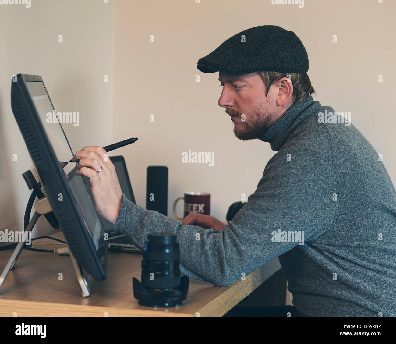 30s Male Working on Touch Screen Stock Photo - Alamy