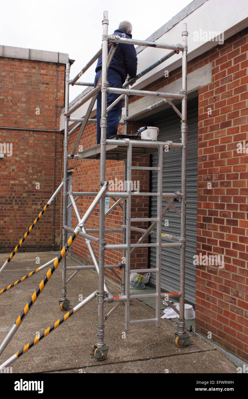 Working on scaffold tower Stock Photo - Alamy