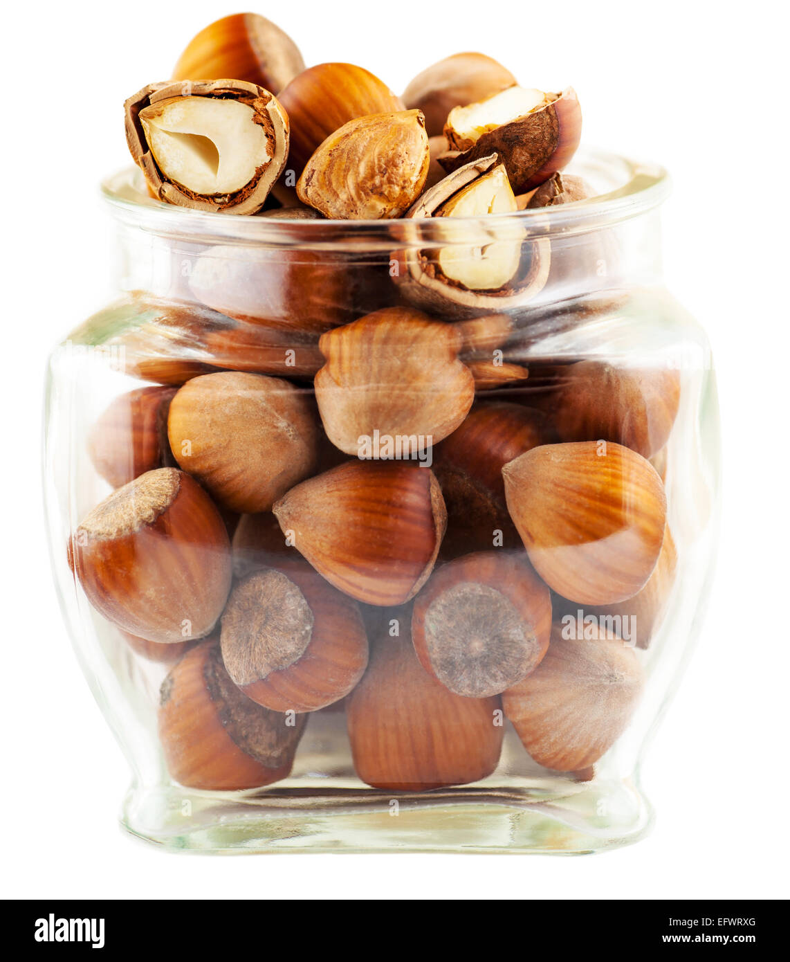 tree nuts in a glass jar isolated on white background Stock Photo - Alamy