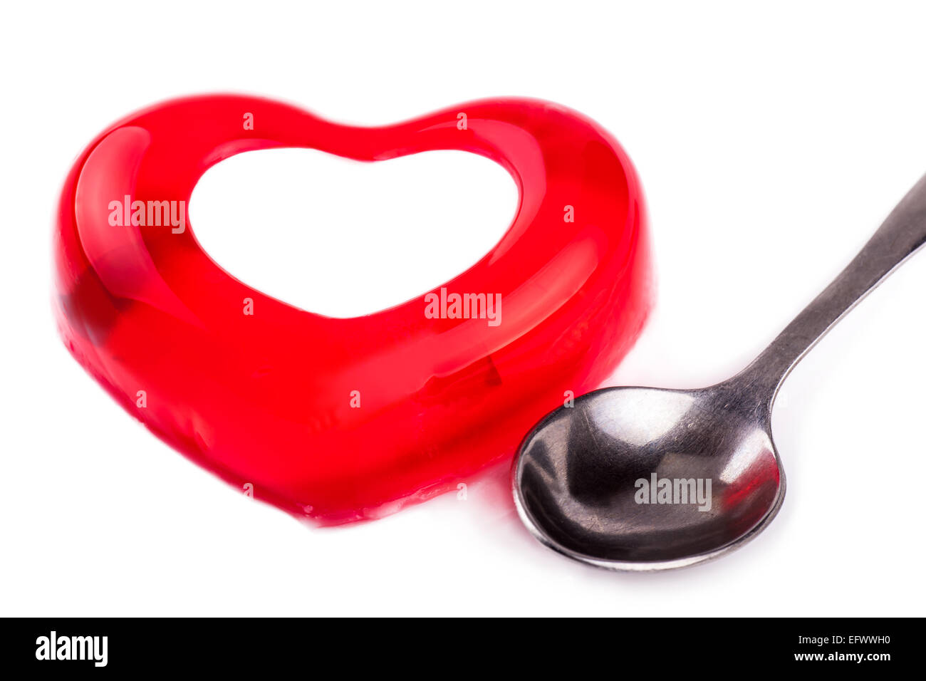 jelly in the form of heart with a spoon on a white background Stock ...