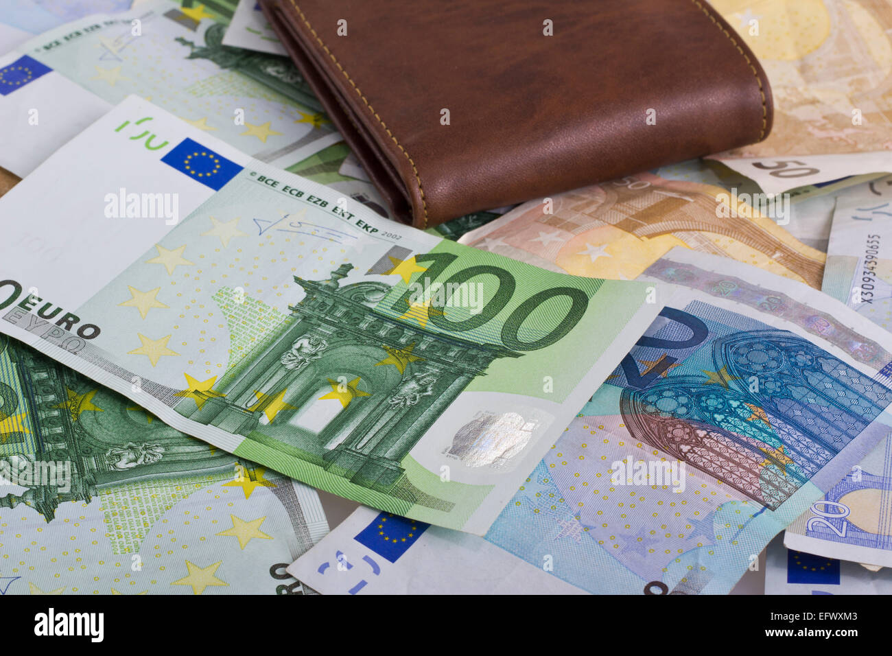 wallet on euro banknotes Stock Photo - Alamy