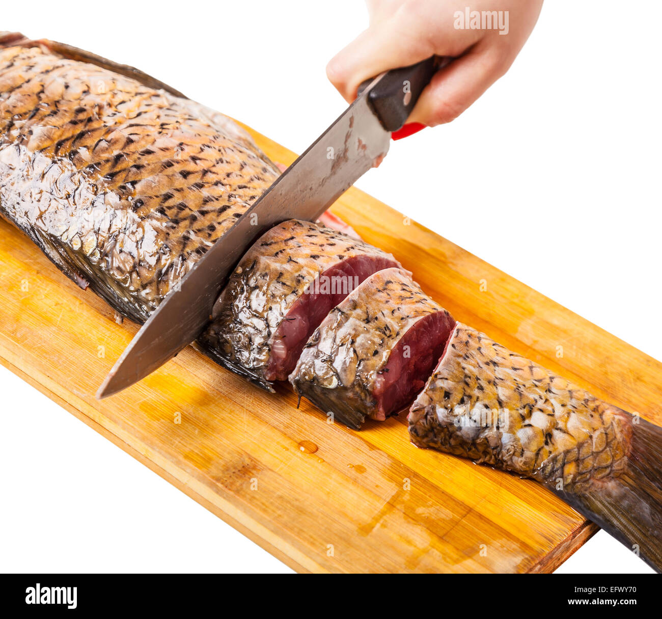 hand with a knife cut fish on the white isolated background Stock Photo ...