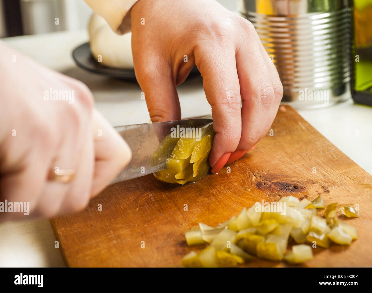 hands closeup cook sliced pickled cucumber diced Stock Photo - Alamy