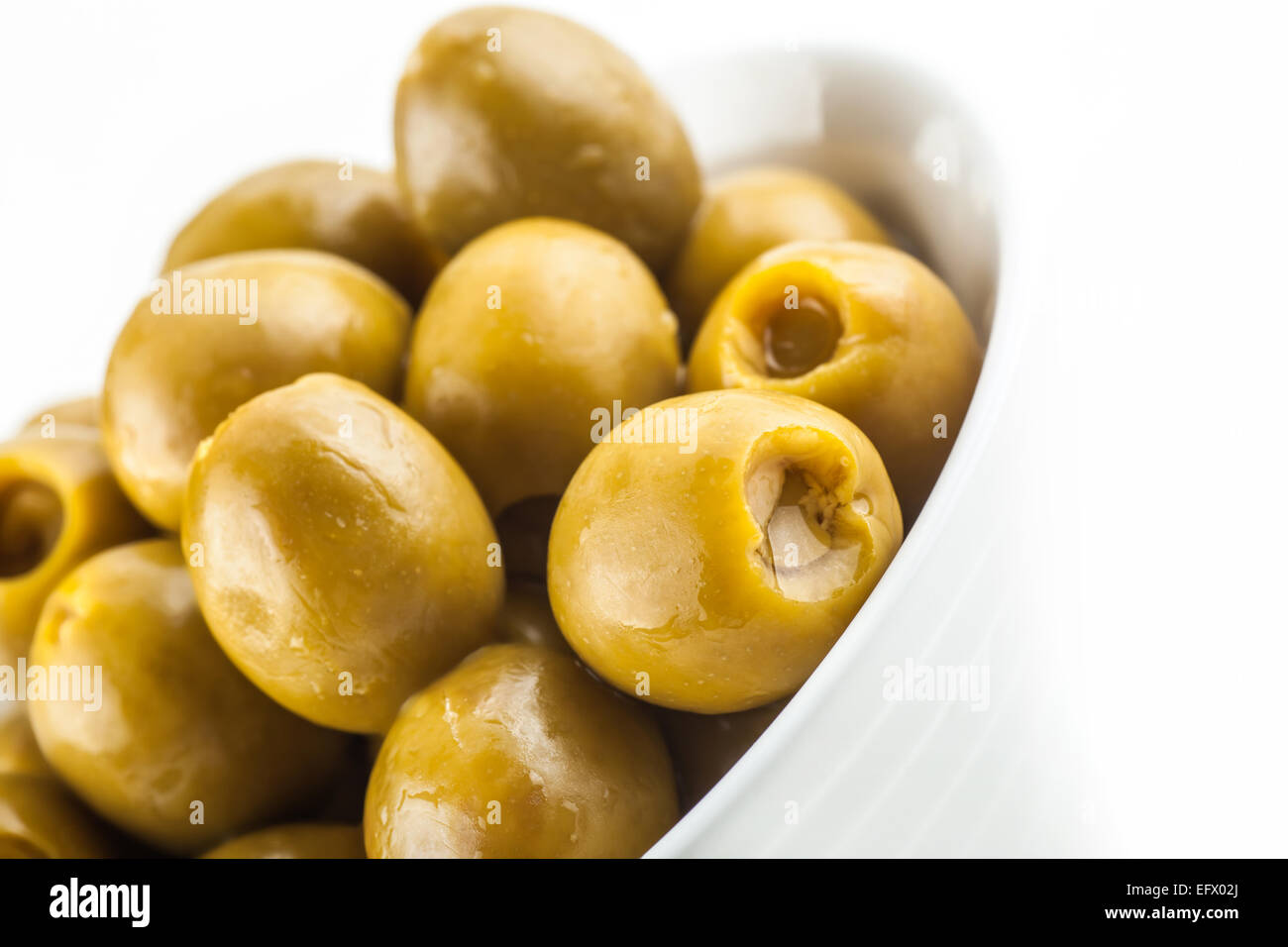 stuffed green olives marinated in a plate closeup Stock Photo - Alamy