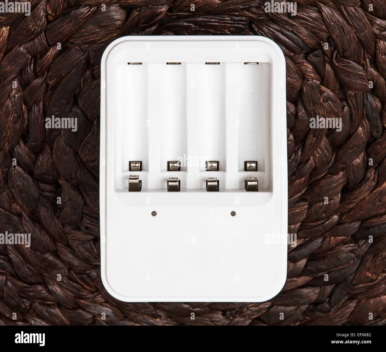 White battery charger. Power source Stock Photo - Alamy