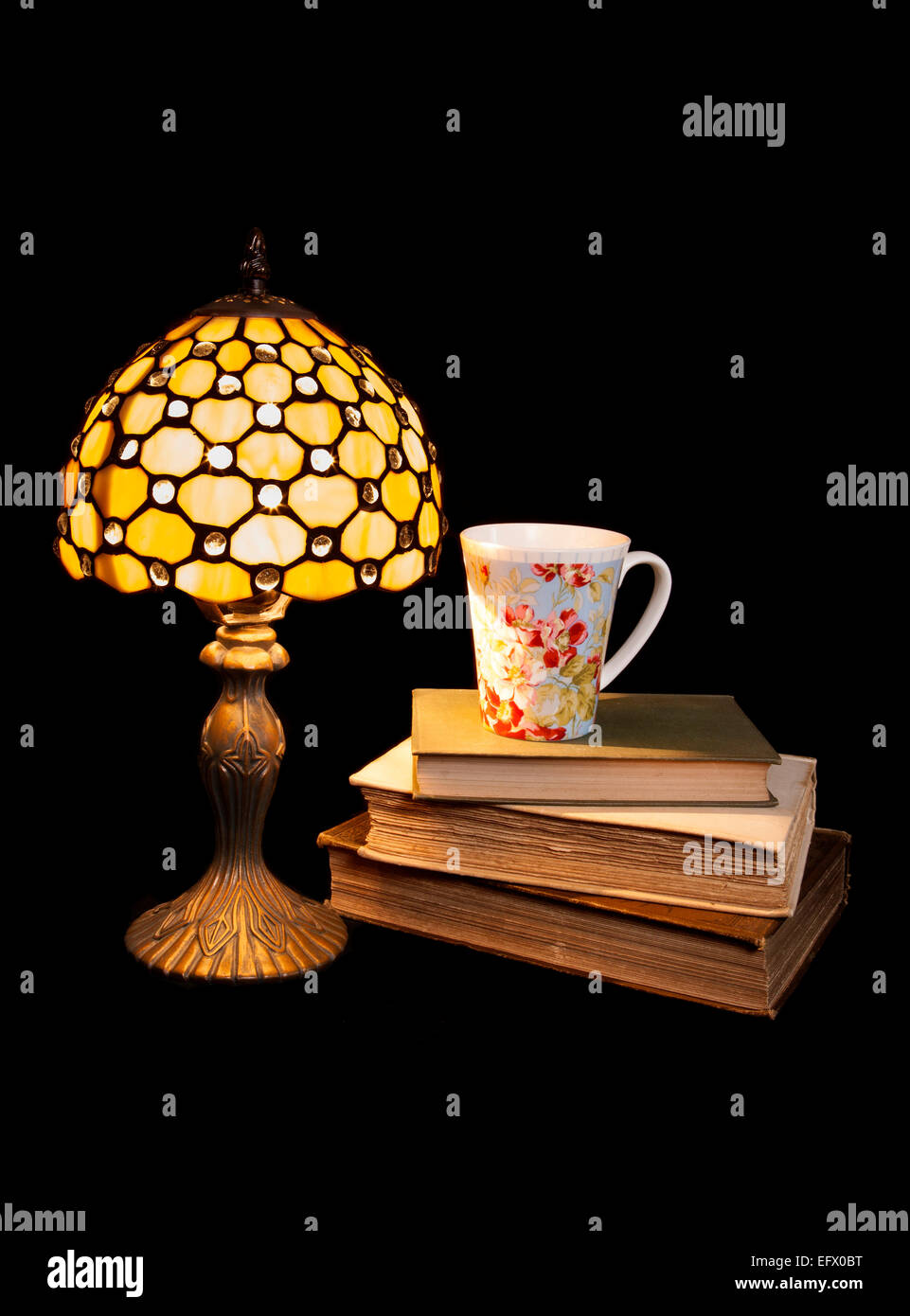 reading at night with a tea cutout Stock Photo - Alamy