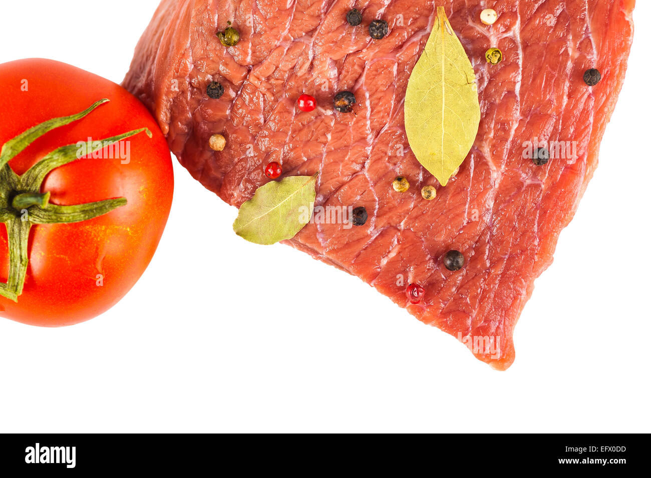 beef filet with spices and tomato, white background Stock Photo - Alamy