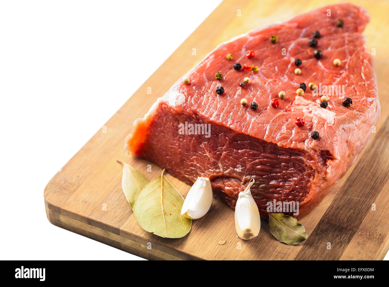 raw beef filet with spices on a wooden board, white background Stock ...