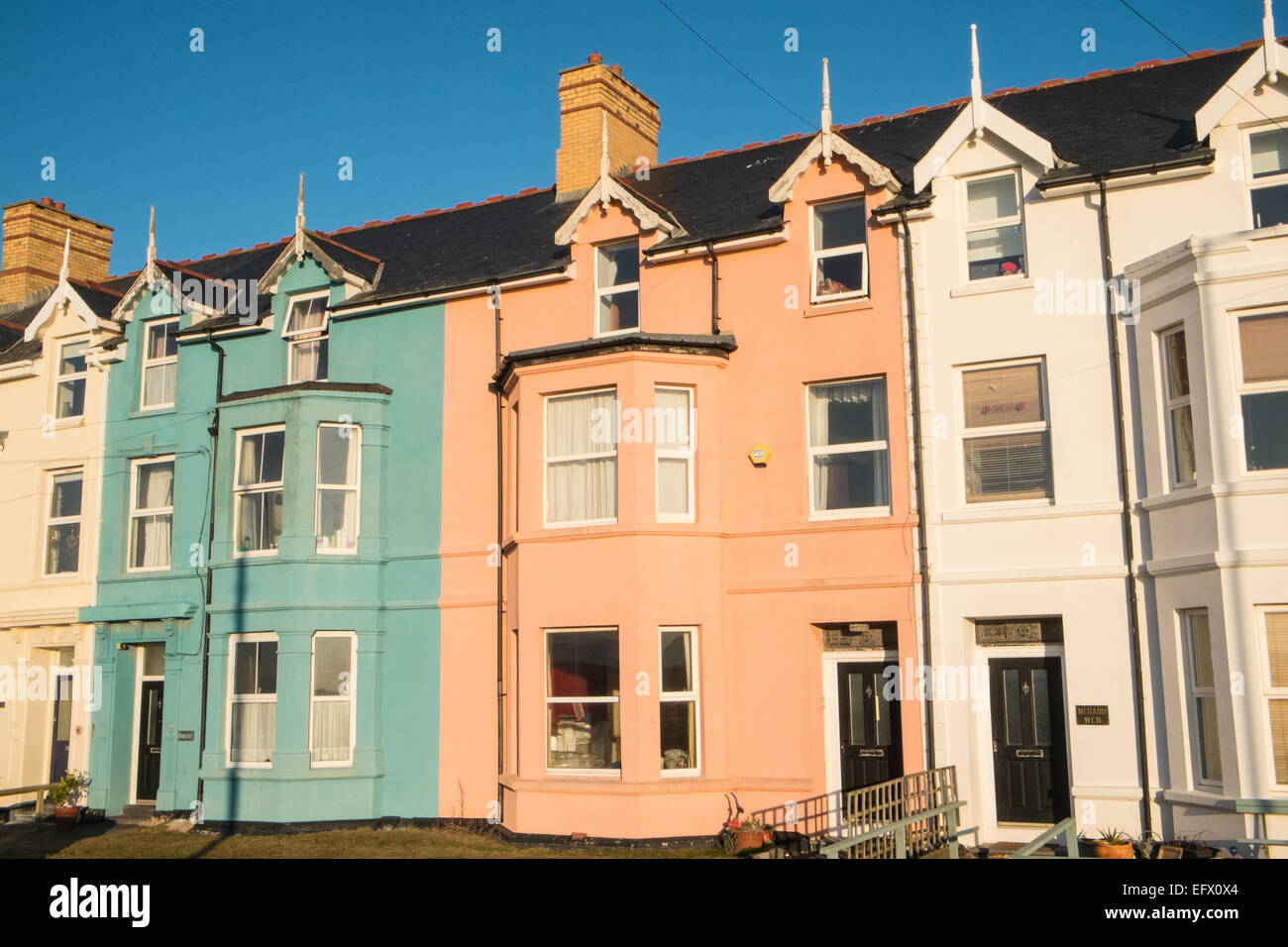 Colourfully painted houses on seafront at Borth, resort village north ...