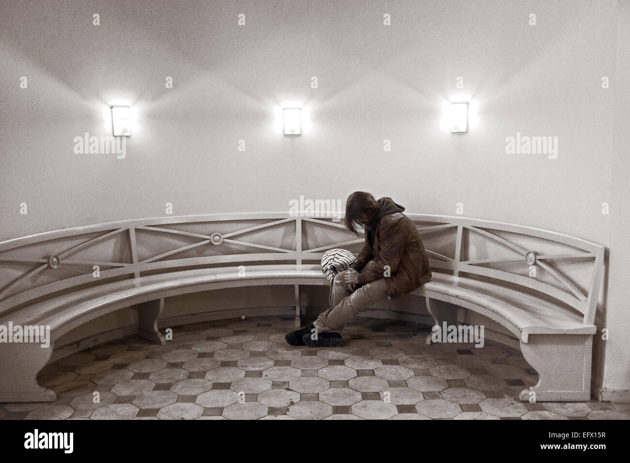 Homeless man takes refuge in church warmth Stock Photo - Alamy