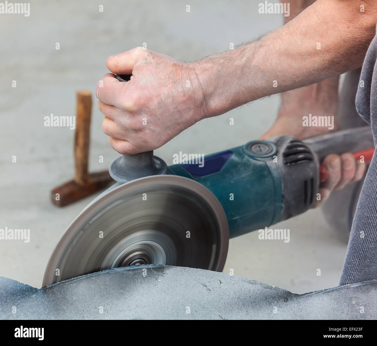 Working with stone grinder, work background Stock Photo - Alamy