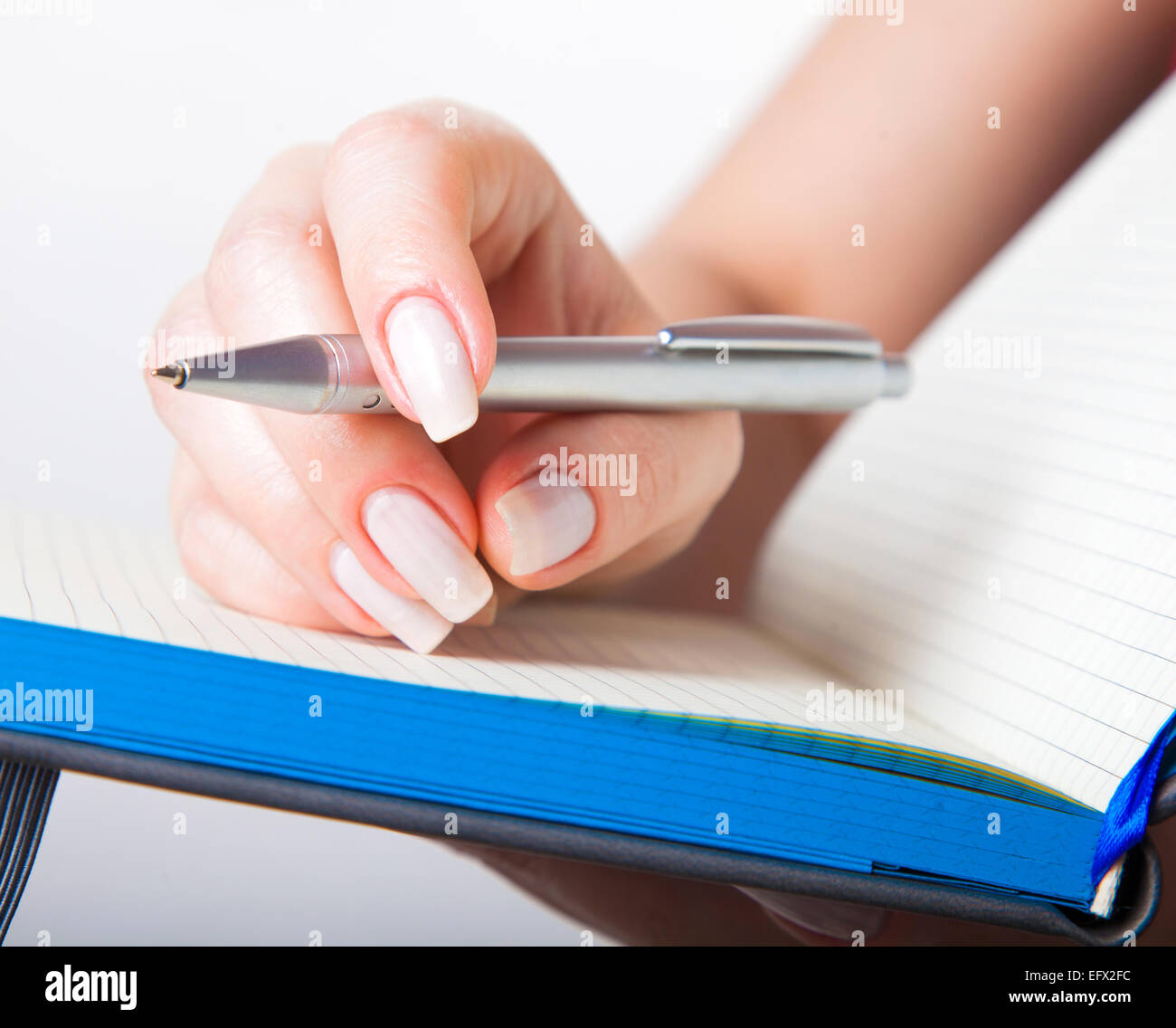 female hand with pen and notebook, business background Stock Photo - Alamy