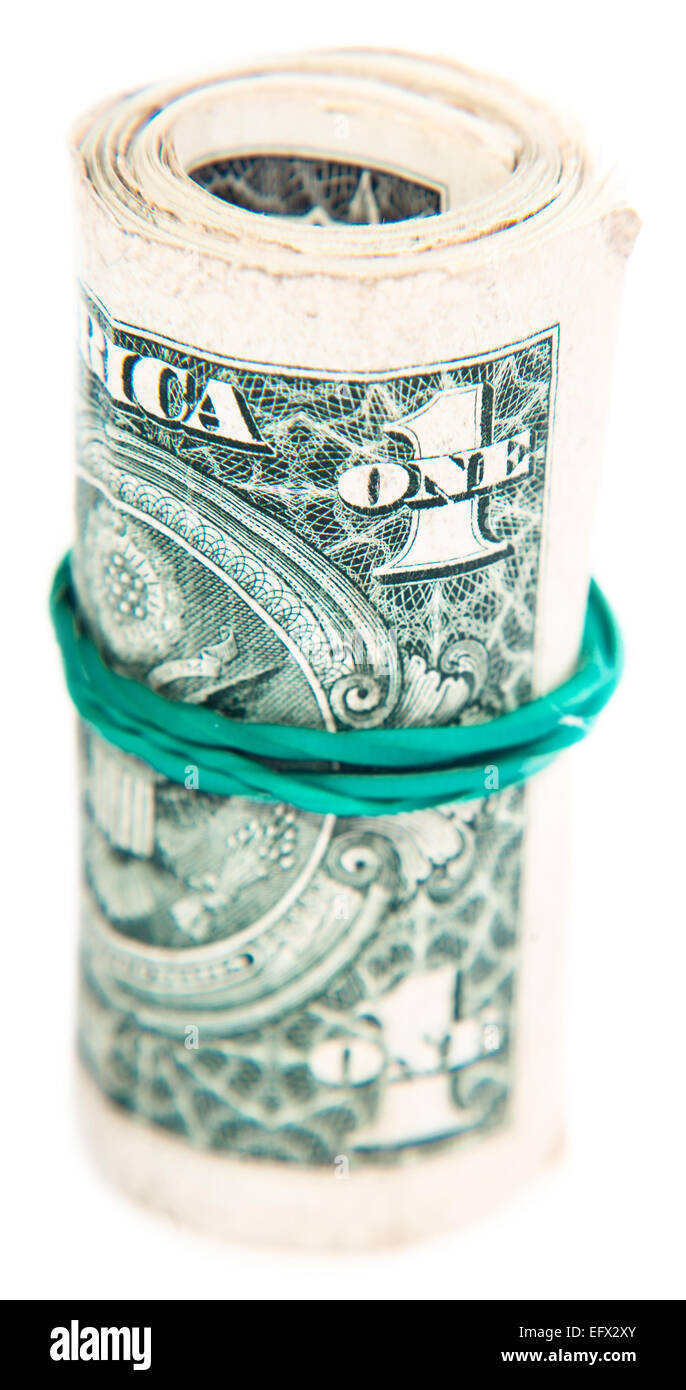 close-up of a roll of dollar banknotes isolated on white background ...