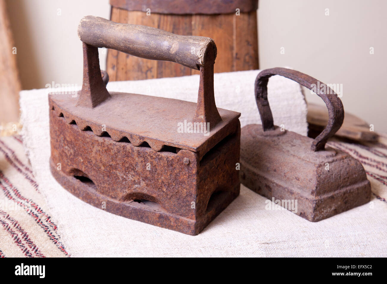 Two rusty old iron for ironing clothes Stock Photo - Alamy