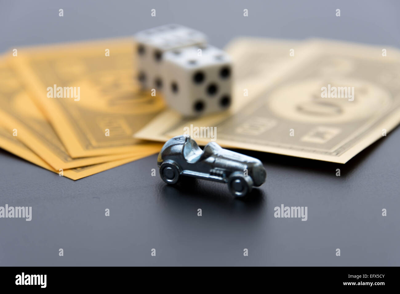February 8, 2015 - Houston, TX, USA. Monopoly car, dice and money Stock ...
