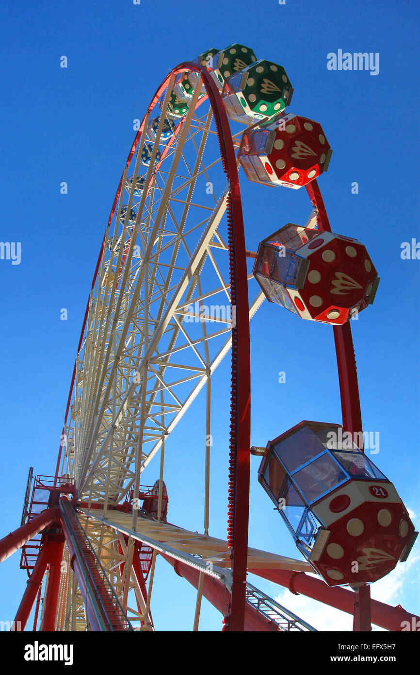 Red ferris wheel on blue sky background Stock Photo - Alamy