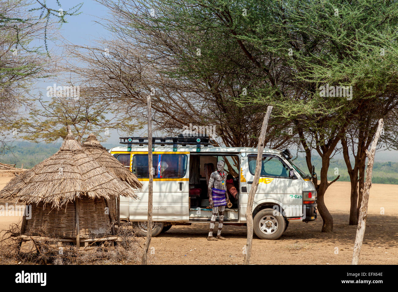 A Village Elder Waits By A Minibus, Kolcho Village, Lower Omo Valley ...