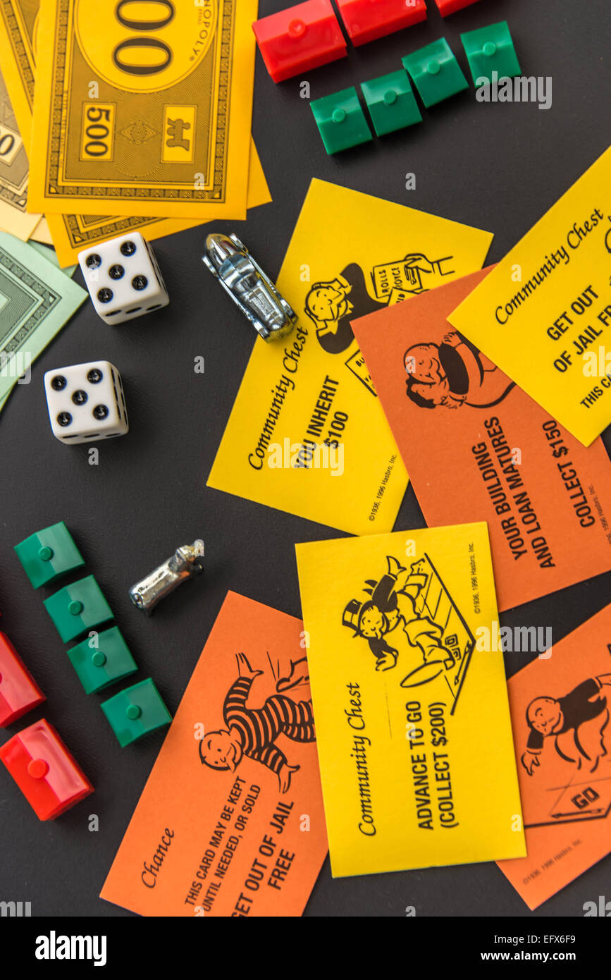 February 8, 2015 - Houston, TX, USA. Monopoly money, playing pieces and ...