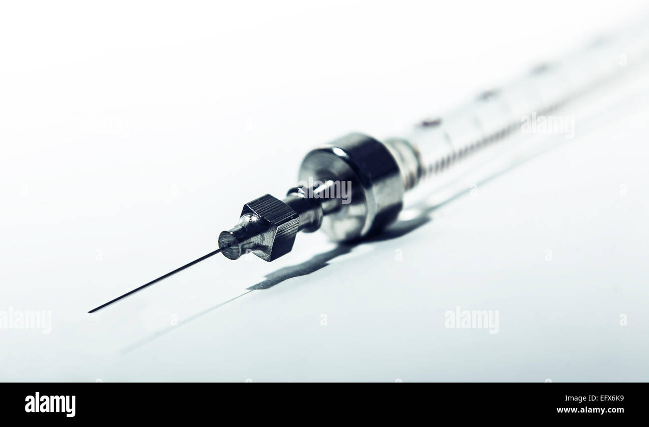 syringe and needle closeup medical background Stock Photo - Alamy