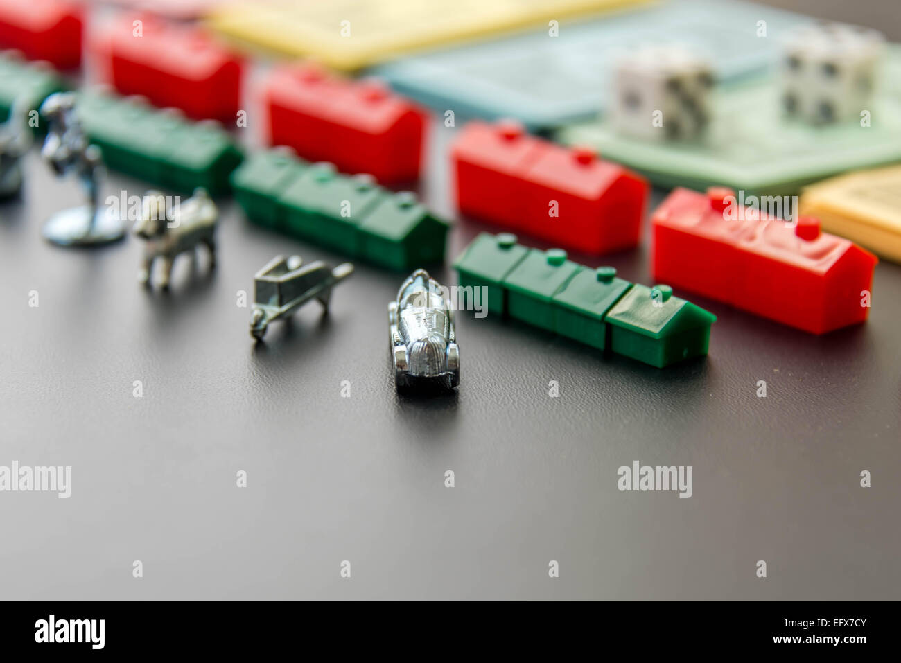 Real money and monopoly pieces hi-res stock photography and images - Alamy