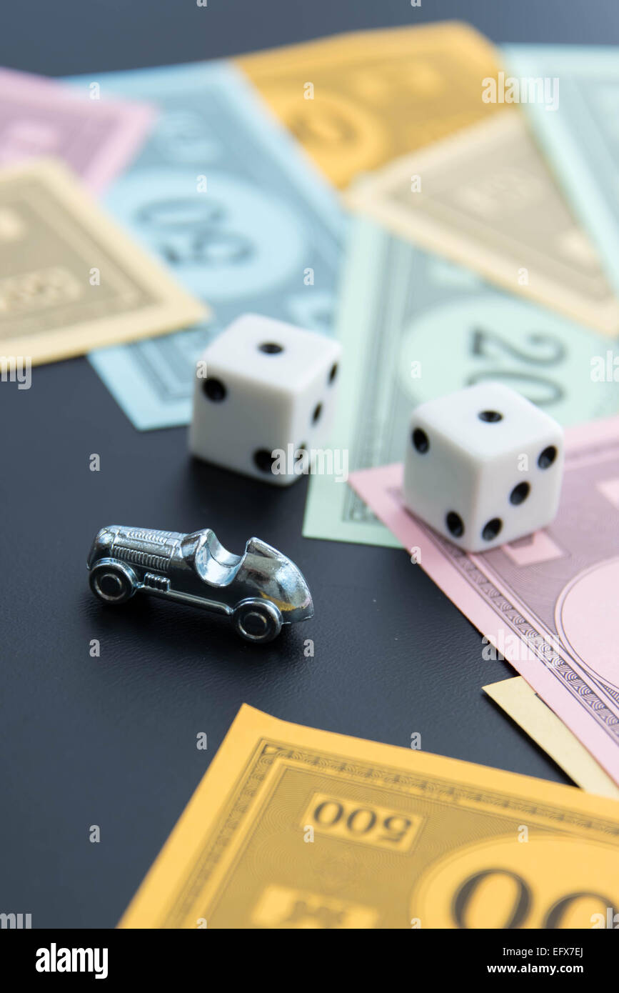 February 8, 2015 - Houston, TX, USA. Monopoly car, dice and money Stock ...