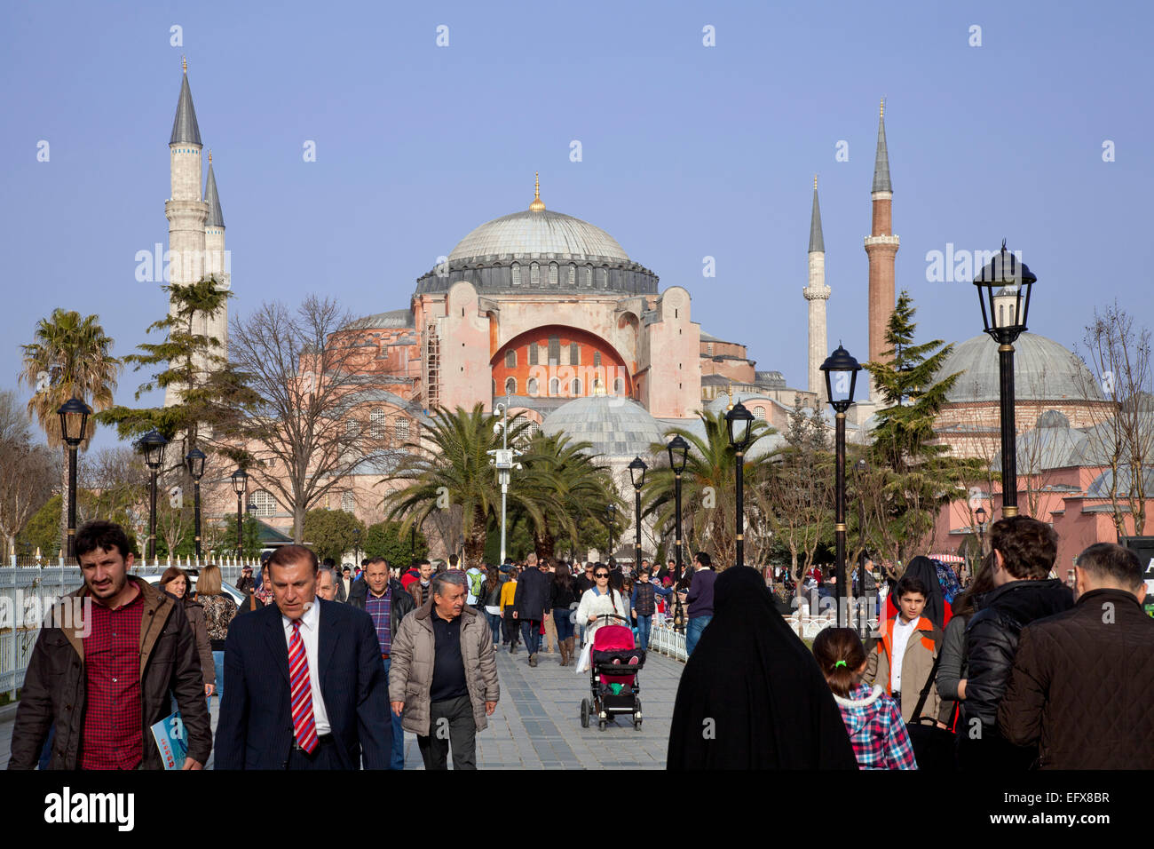 Haghia Sophia, Sultanhamet, Istanbul with people, street lamps and palm ...