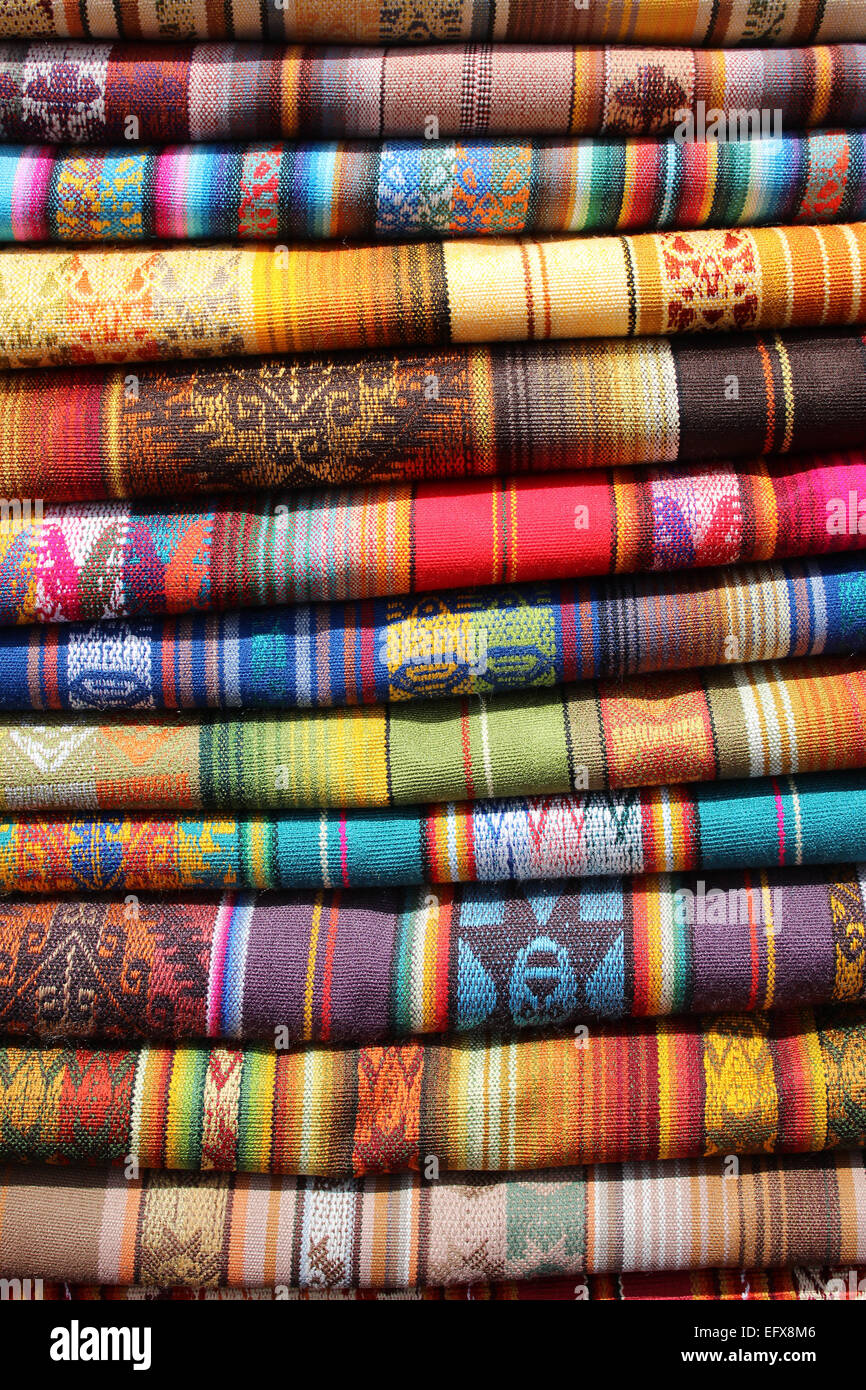 Handmade cloth blankets for sale at the outdoor craft market in Otavalo ...