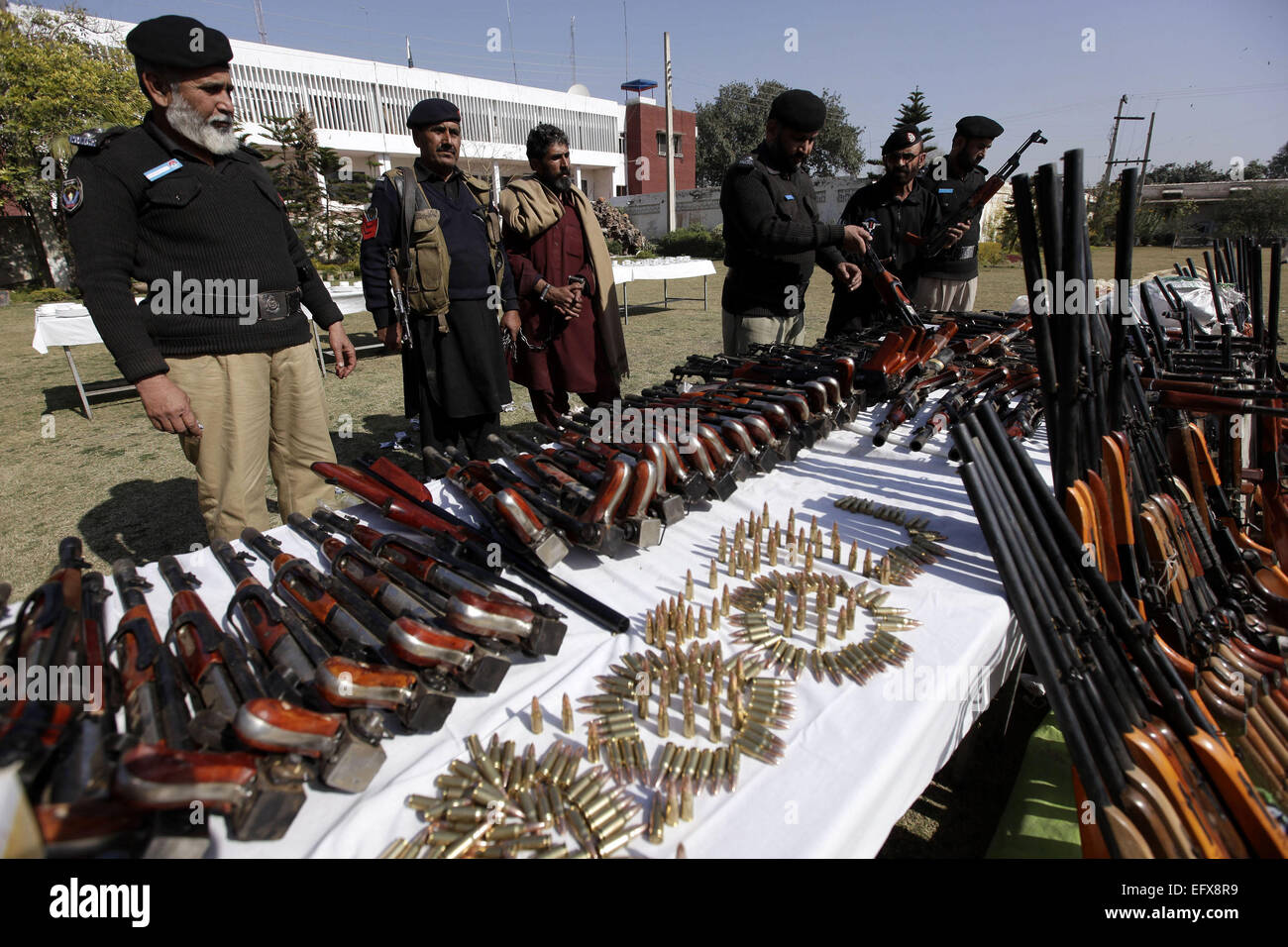 Peshawar. 11th Feb, 2015. Pakistani policemen display arms and ...