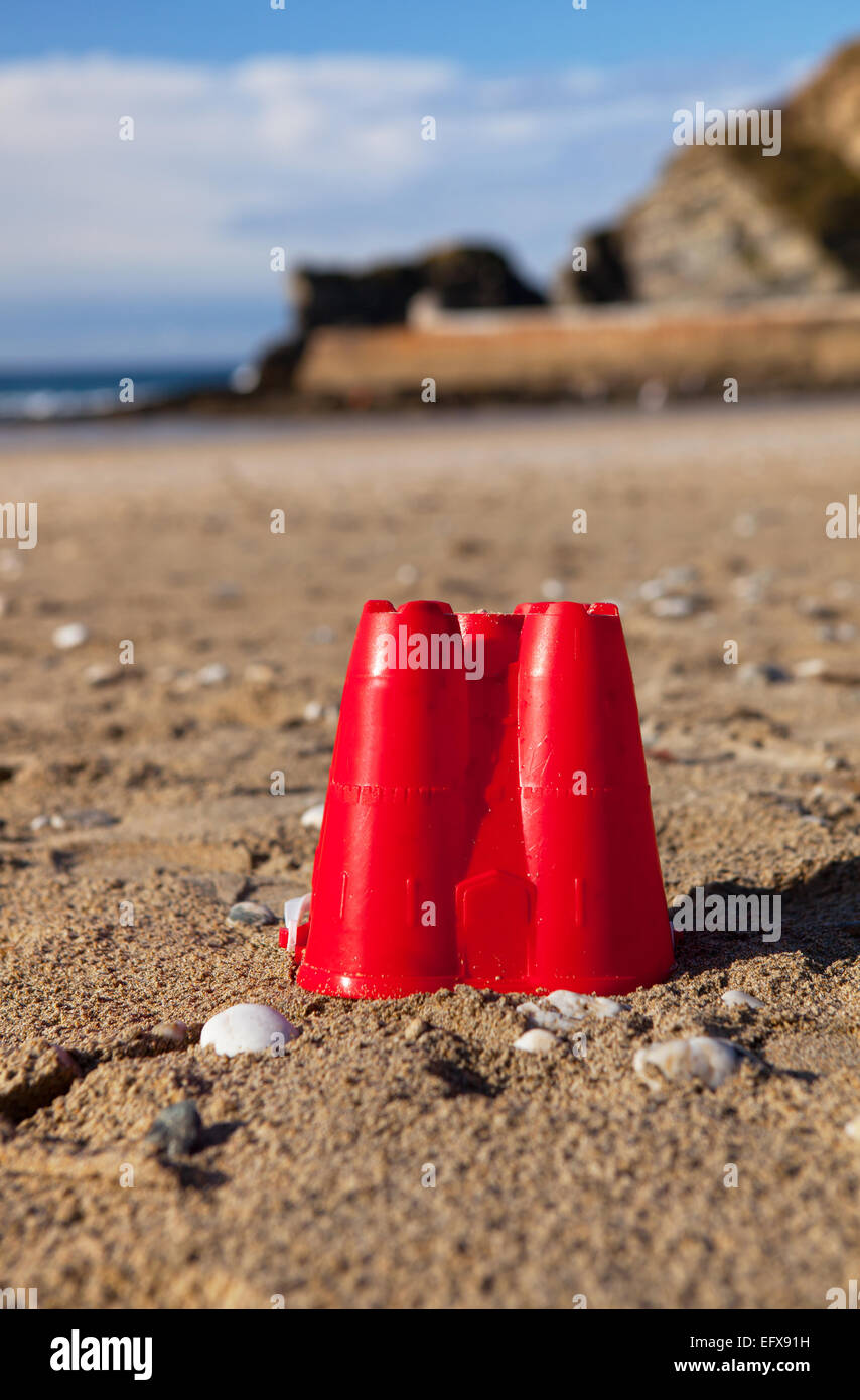 Sandcastle bucket on beach in cornwall by St. Agnes. sand activity ...