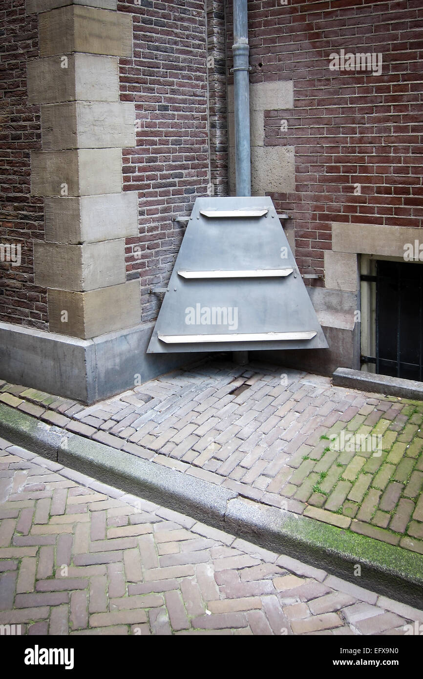 A metal deflector device to discourage male urination in this building ...