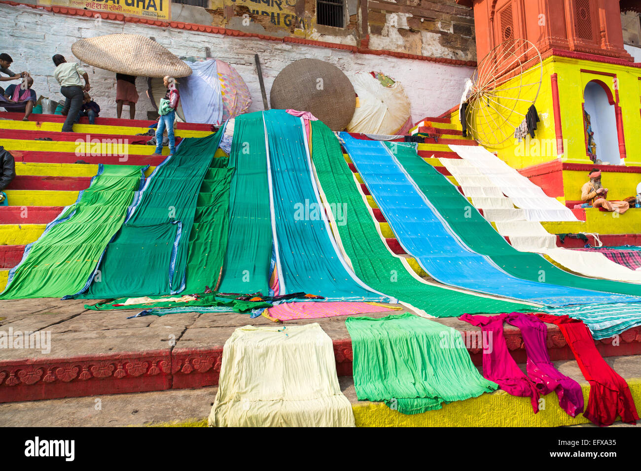 Washing and drying clothes on ghat steps hi-res stock photography and ...