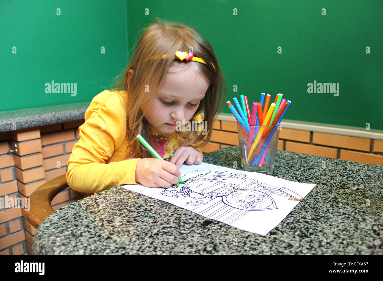 image of little girl drawing at the table Stock Photo - Alamy