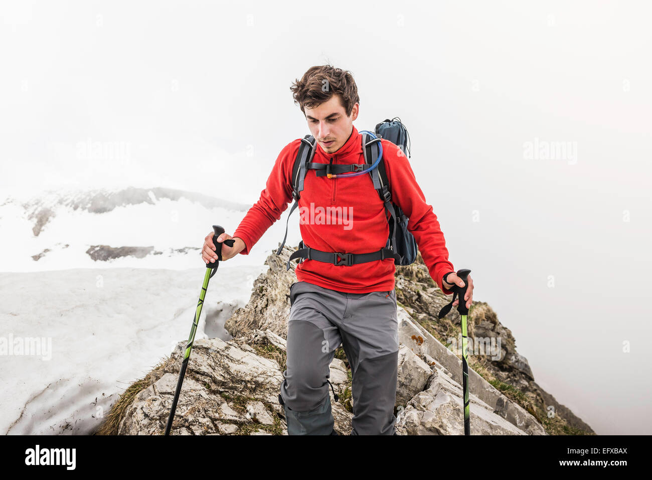 Young man trekking in Bavarian Alps, Oberstdorf, Bavaria, Germany Stock ...