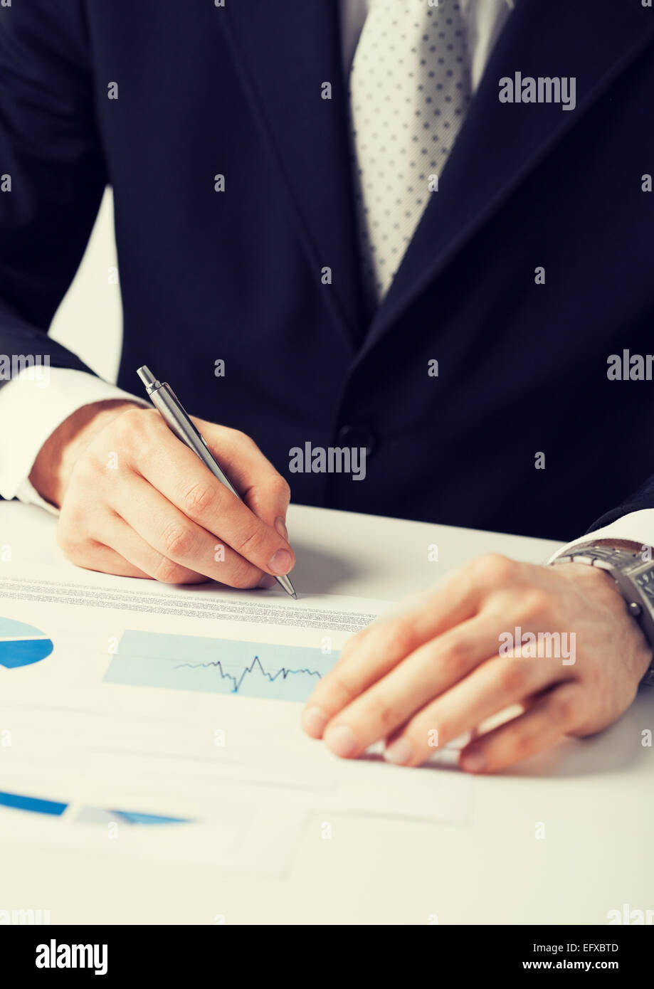 businessman working and signing paper Stock Photo - Alamy