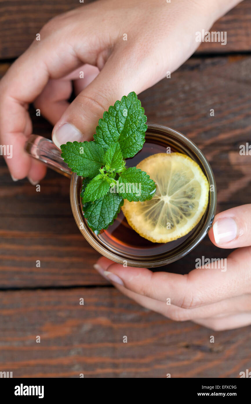 Woman hands holding tea cup Stock Photo - Alamy