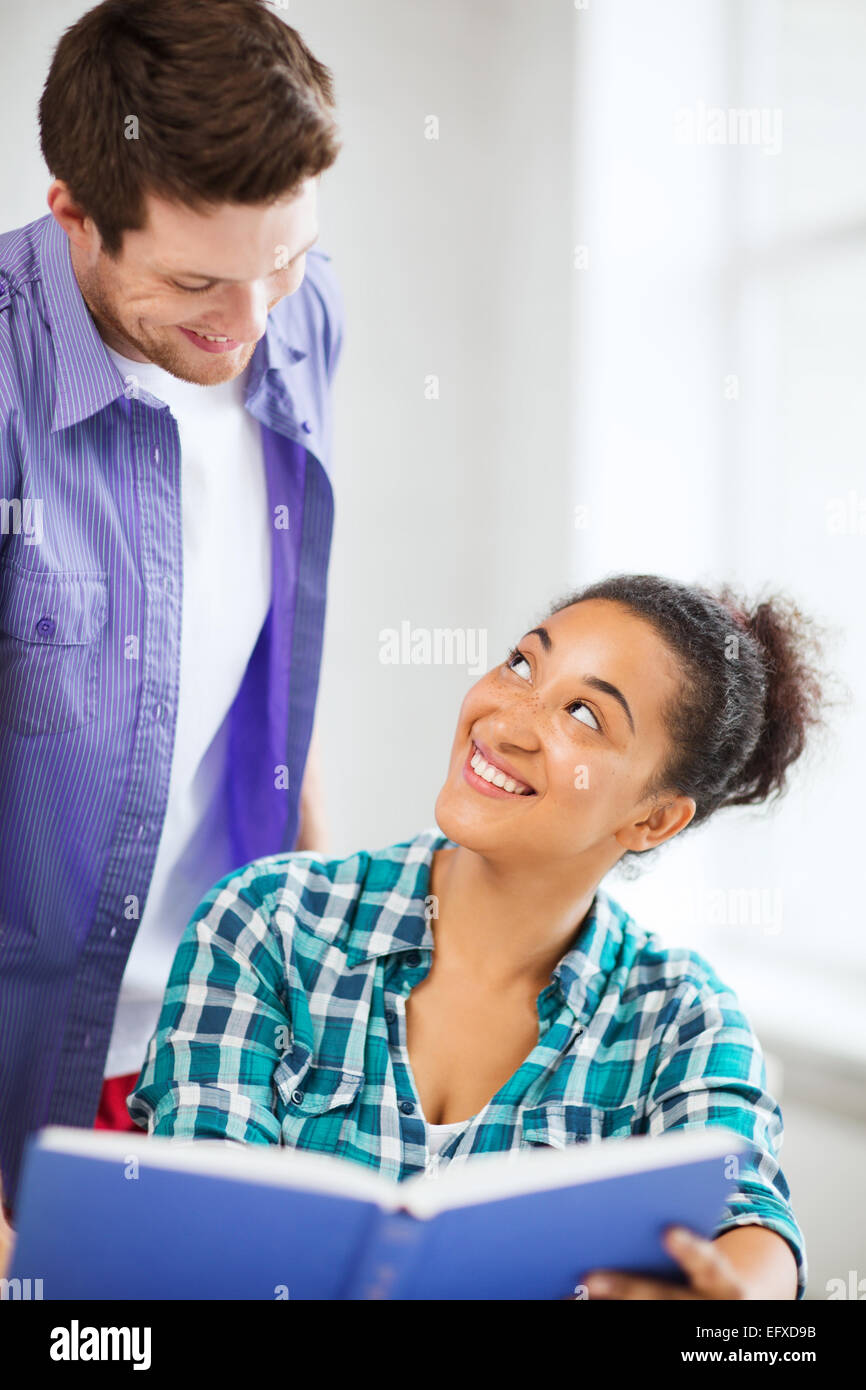 students reading book at school Stock Photo - Alamy