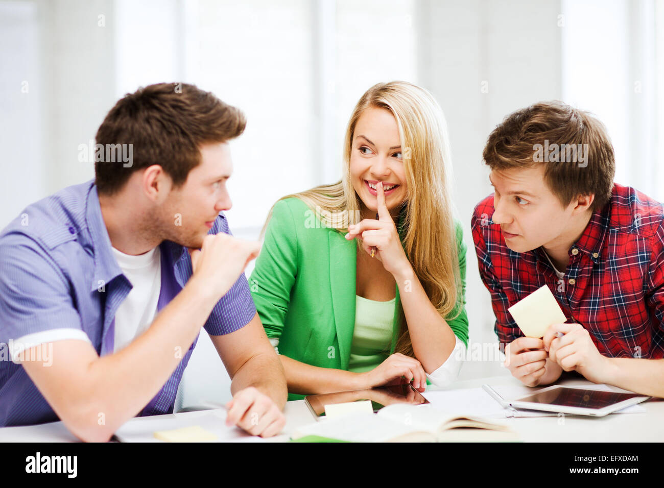 group of students gossiping at school Stock Photo - Alamy