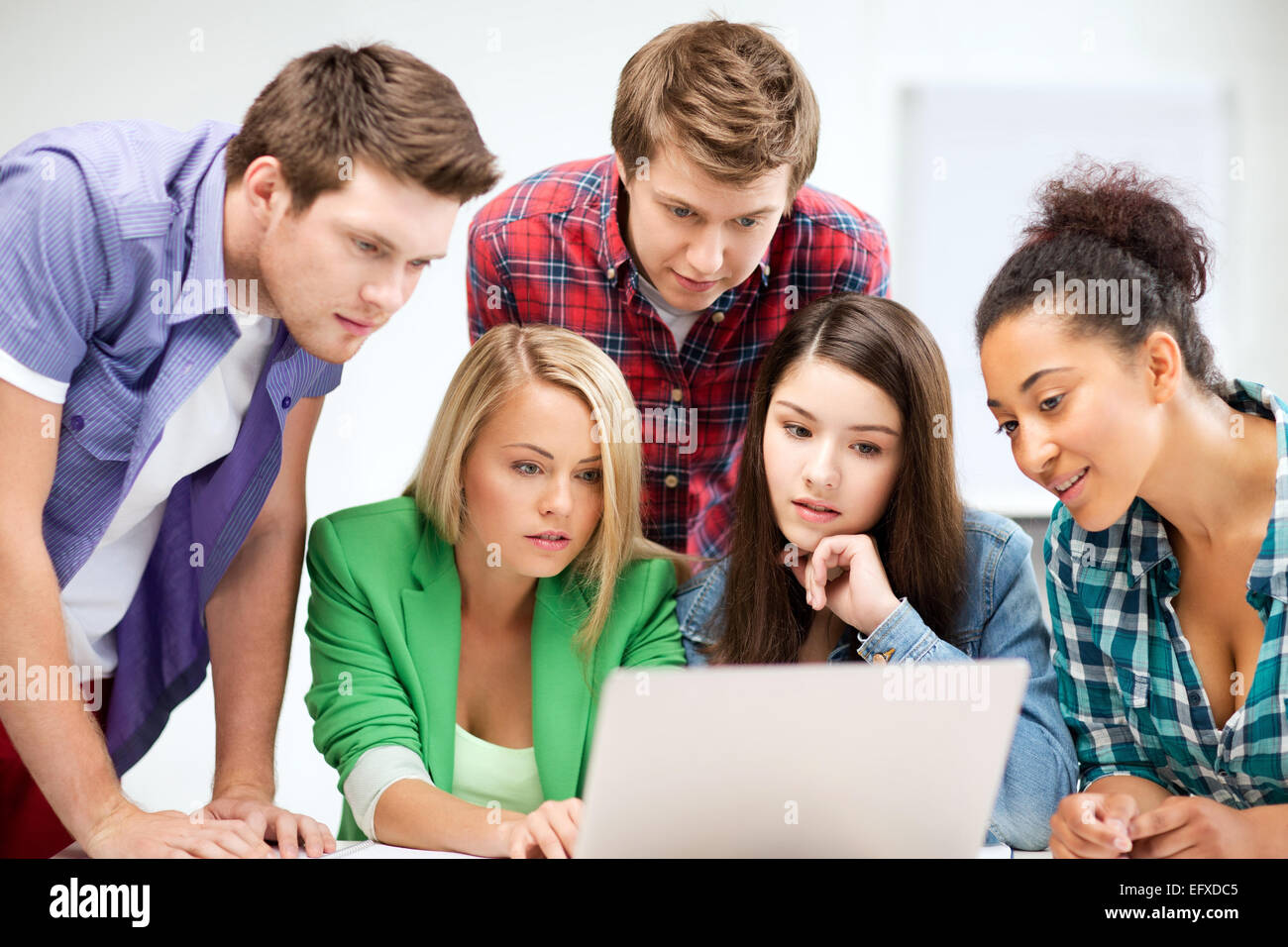 international students looking at laptop at school Stock Photo - Alamy