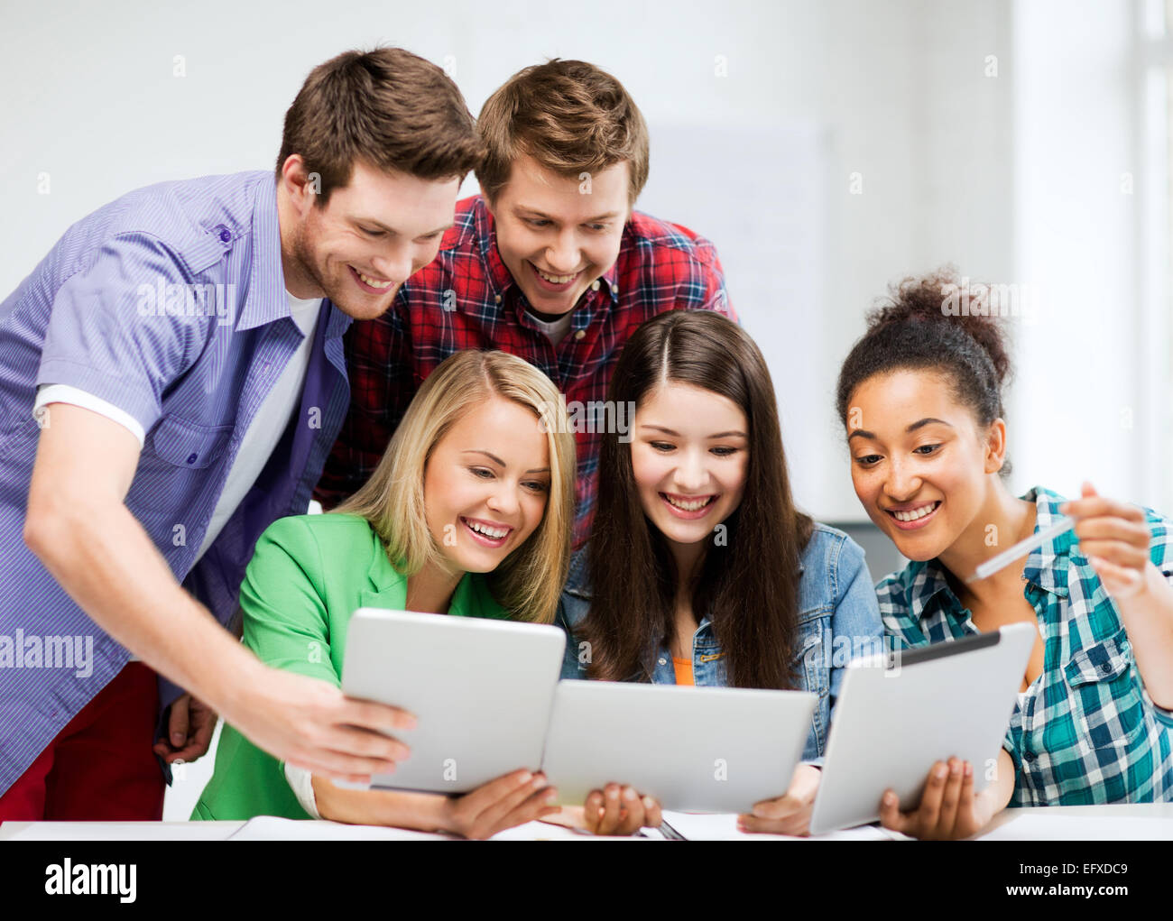 students looking at tablet pc in lecture at school Stock Photo - Alamy