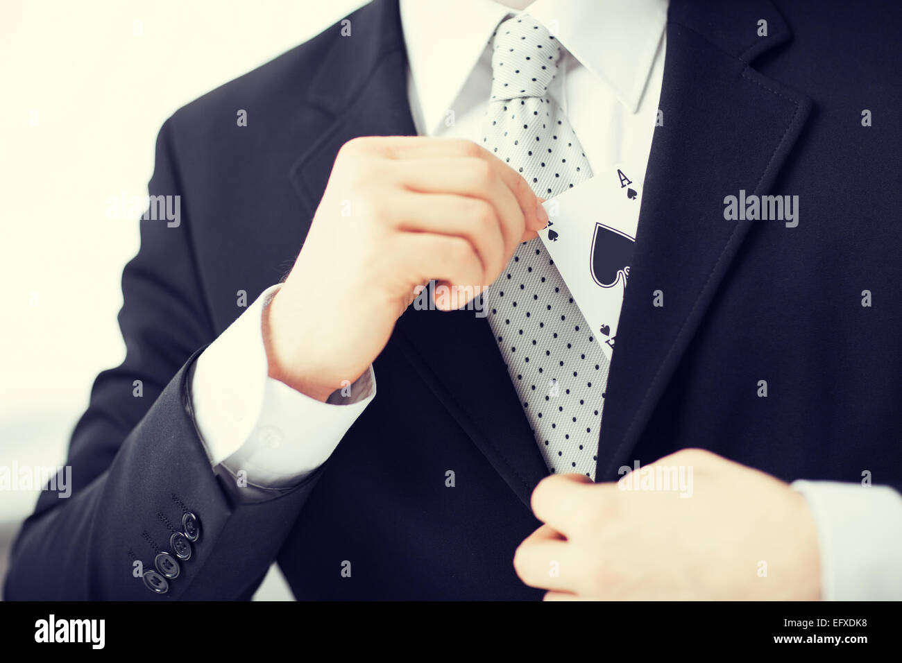 mans hand hiding ace in the jacket pocket Stock Photo - Alamy
