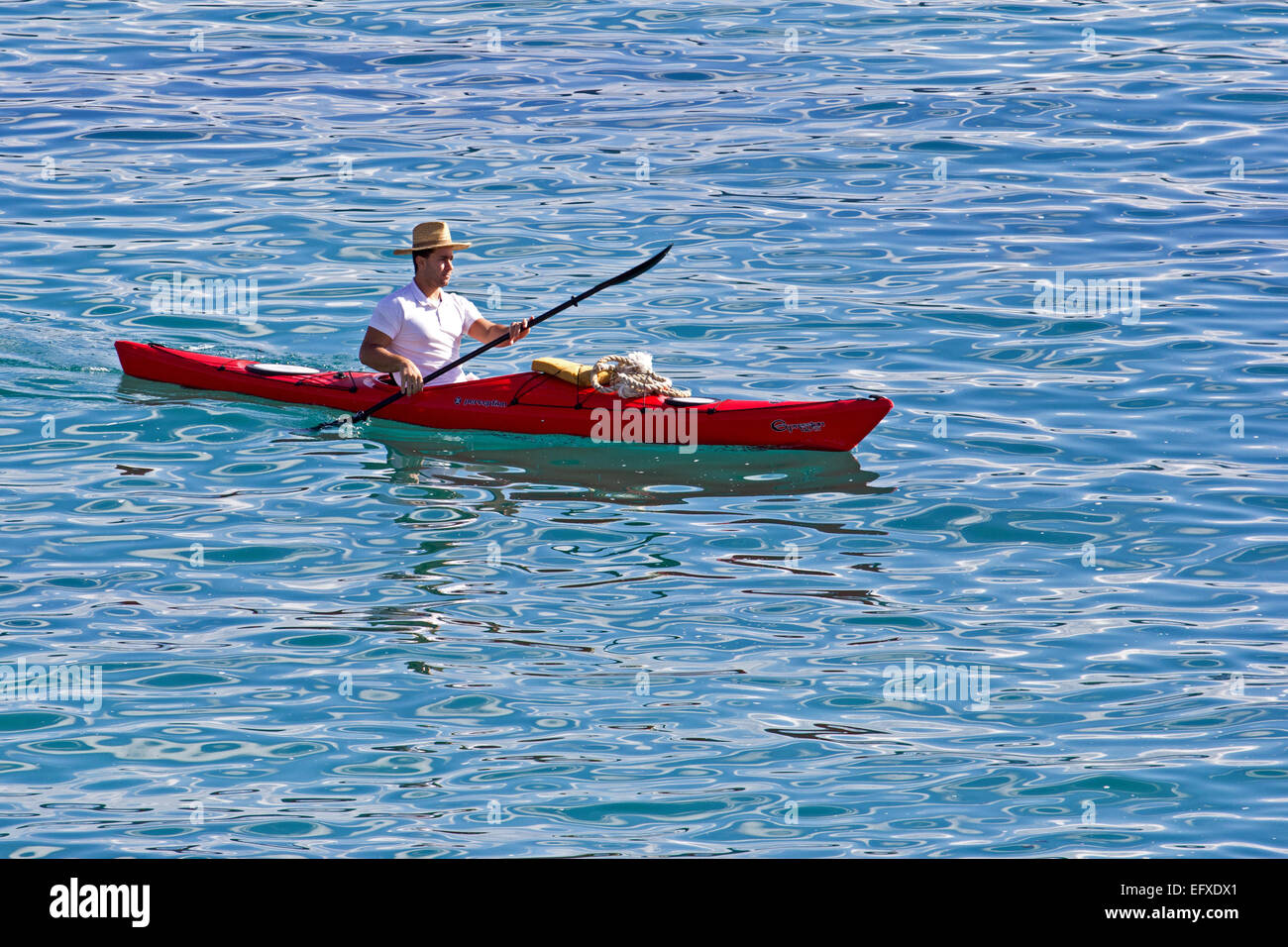 Man rowing kayak Stock Photo - Alamy