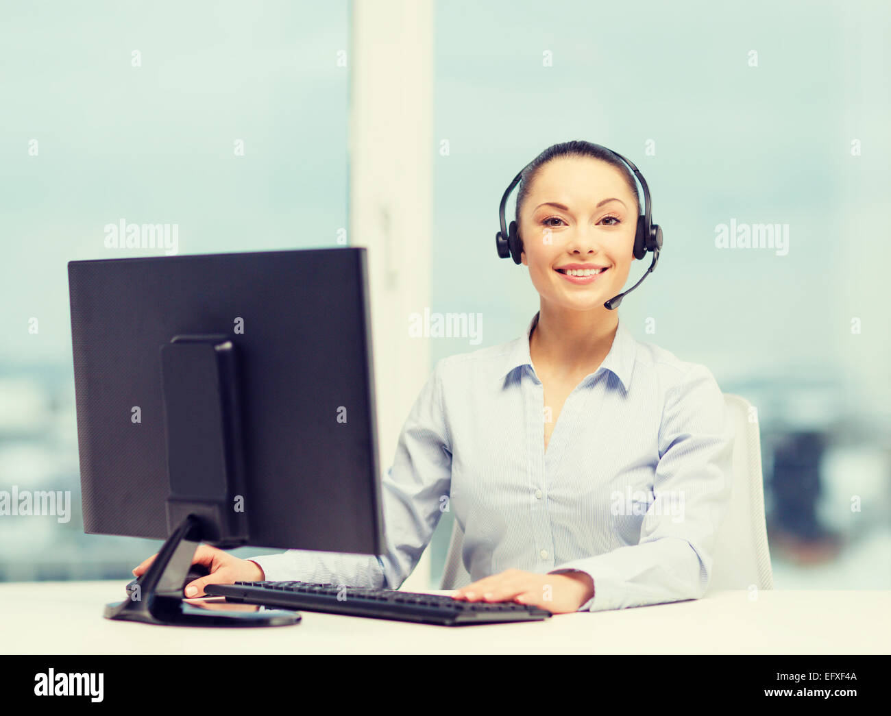 friendly female helpline operator Stock Photo - Alamy